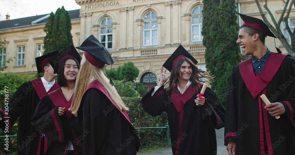 Young mixed-races joyful and happy girls and guys, graduated students ...