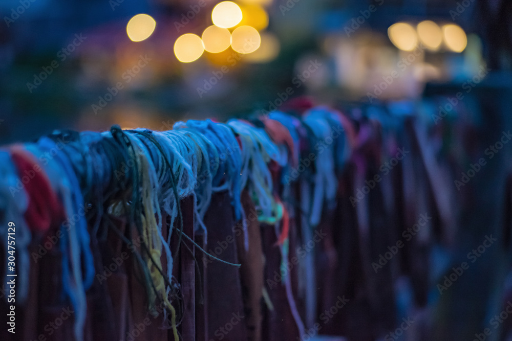 Prayer tags tied on the bridge in the Pilok mine village in ...