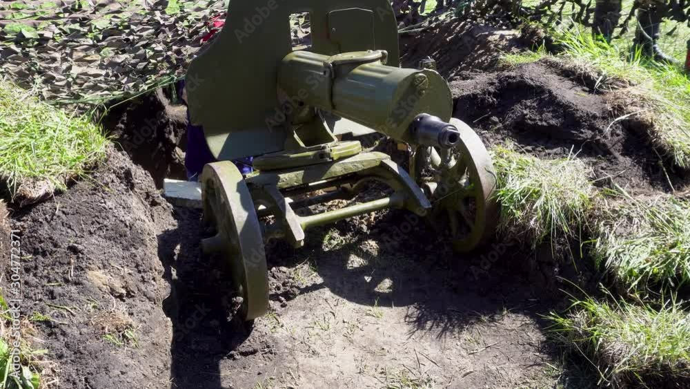 Old machine gun in a fortifying position. Strong weapon of past wars. A ...