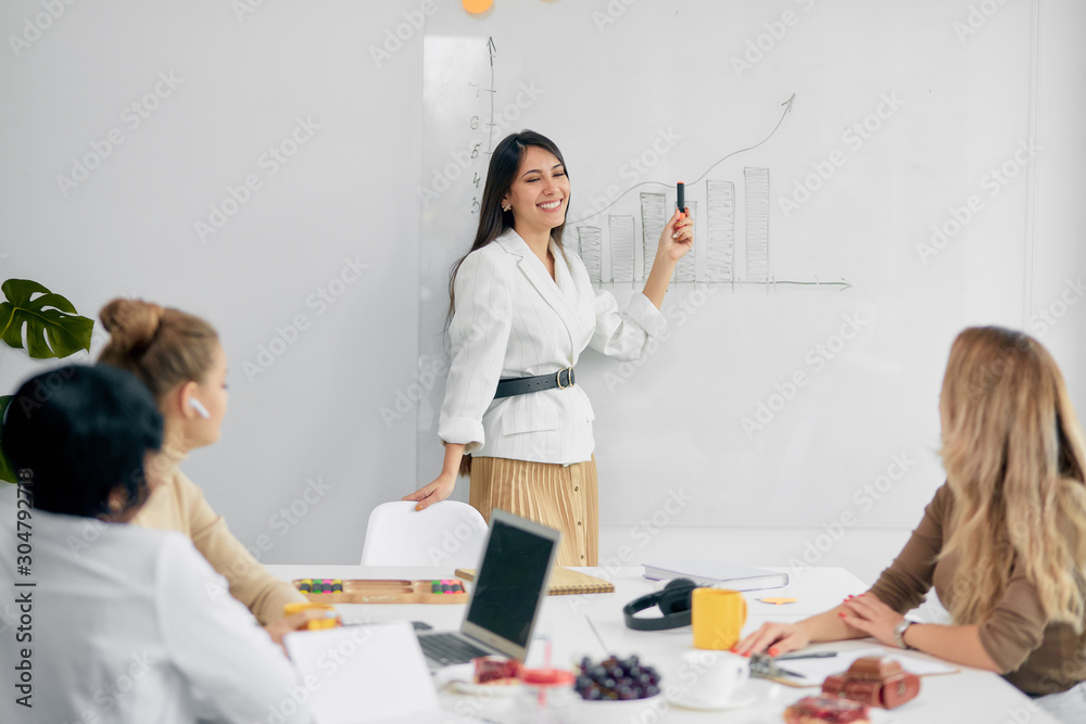Beautiful caucasian business lady with long dark hair giving a ...