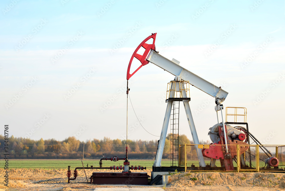 Oil drilling derricks at desert oilfield for fossil fuels output and ...