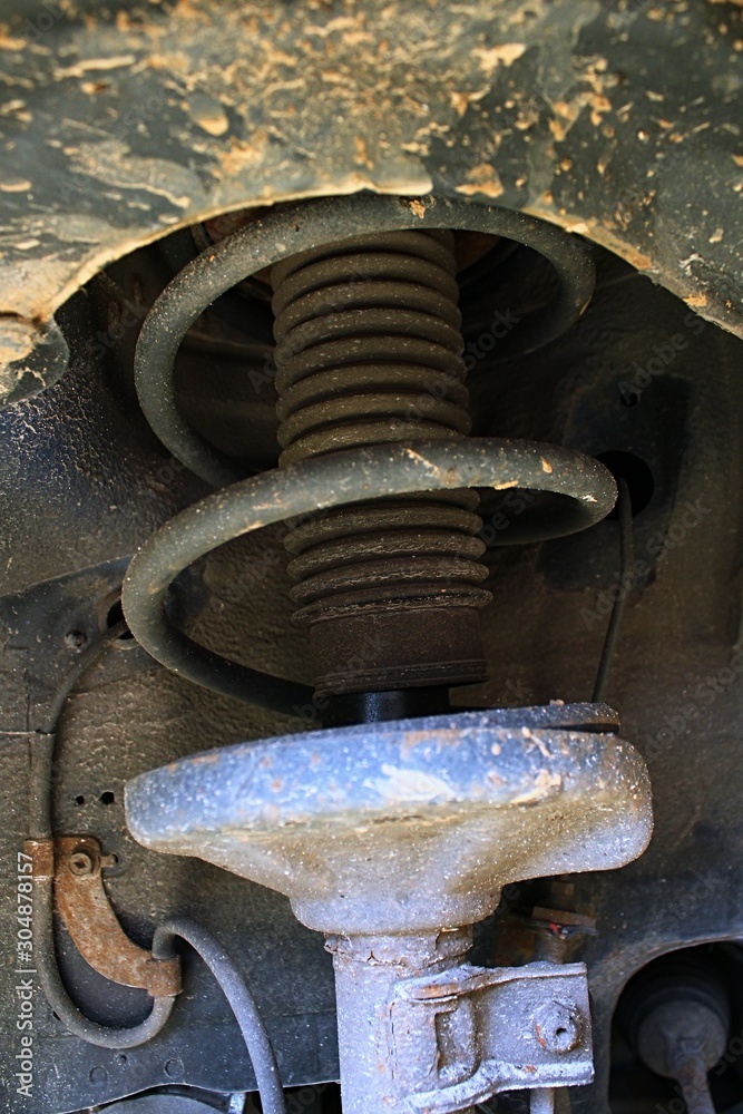 Detail of wheel coil damper spring suspension on 13-years old japanese ...