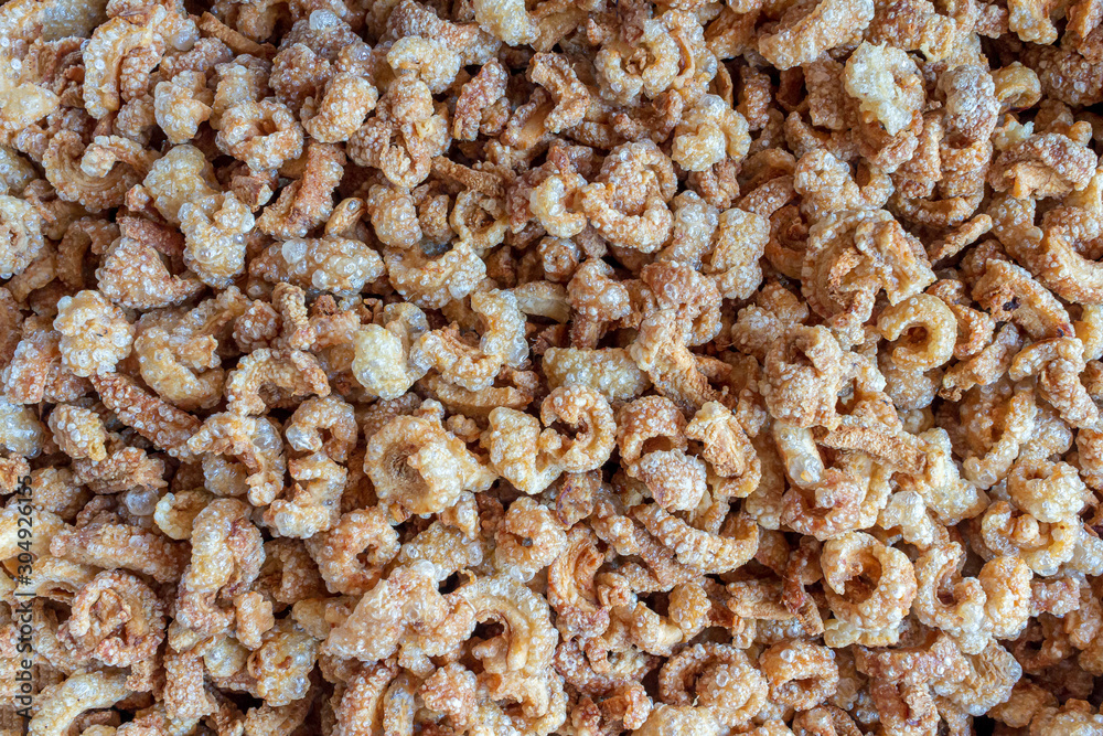 Pile of deep fried or bake pork snack, pork rind, pork scratching or ...