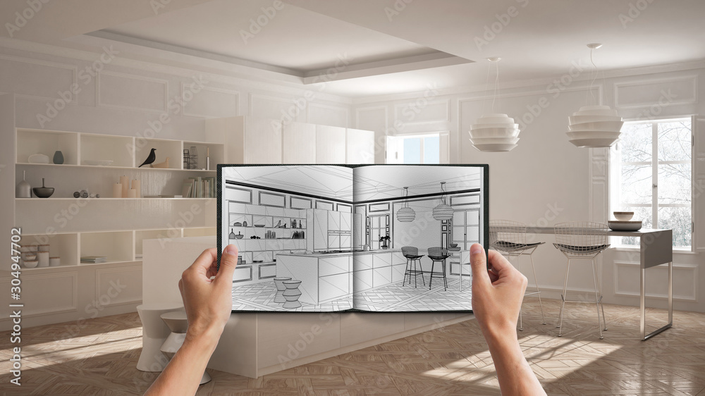 Hands holding notepad with creative kitchen design blueprint sketch or ...