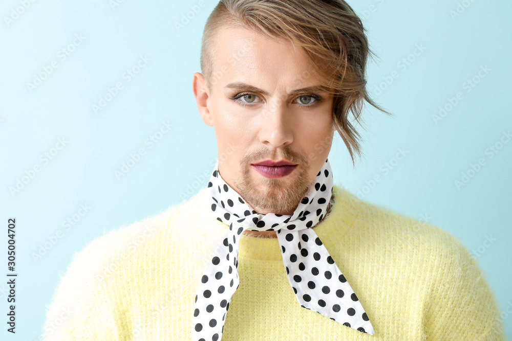 Portrait of young transgender woman on color background Stock Photo ...