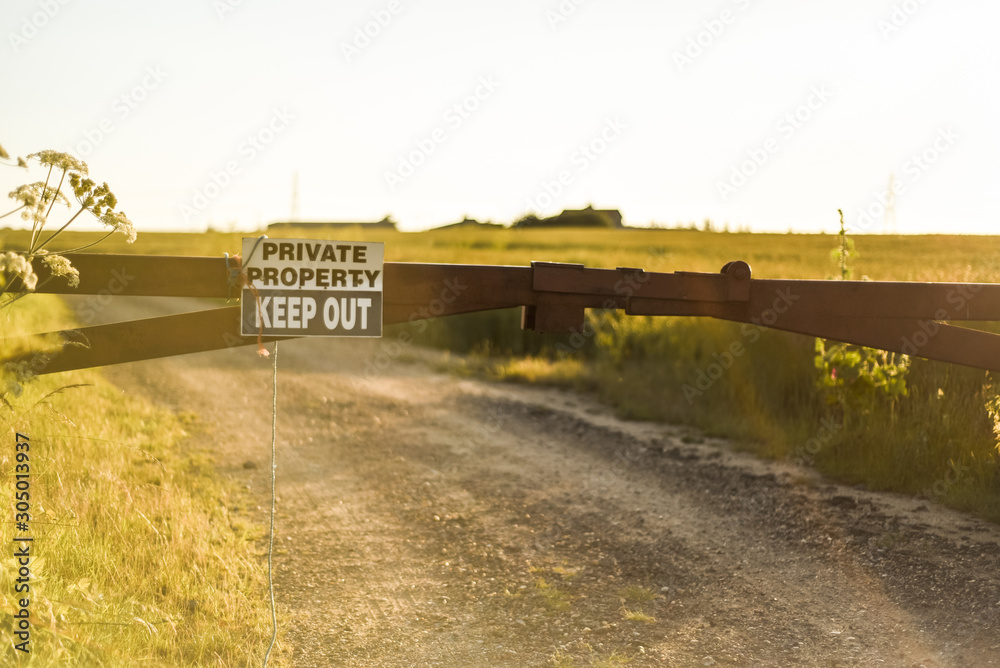 Keep out sign over private farm land. Stock Photo | Adobe Stock