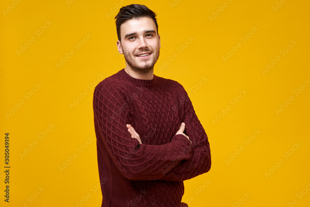 Masculinity, confidence and body language. Isolated shot of handsome ...
