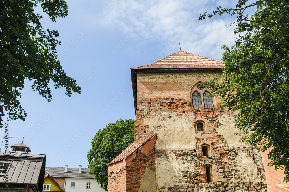 Domininkon vienuolynas. The ruins of Trakai Peninsula Castle located on ...