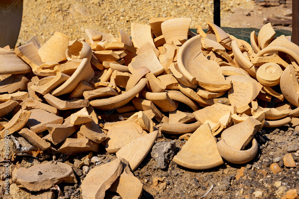 Broken clay pottery on floor with sunlight background, Bahrain. Stock ...