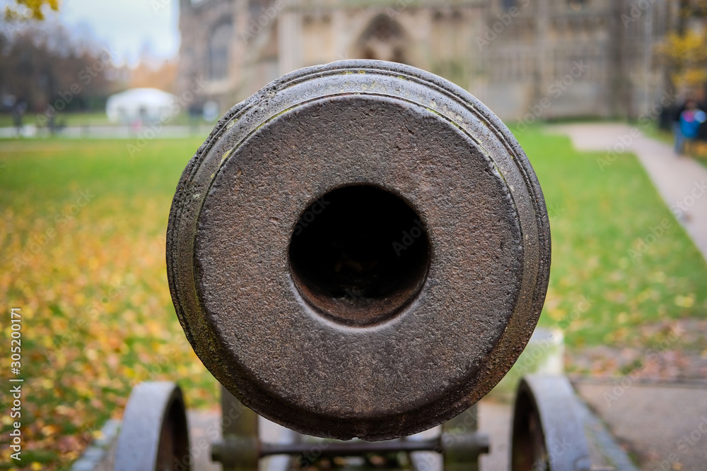 Close-up, shallow focus of an ancient, English wrought iron cannon ...