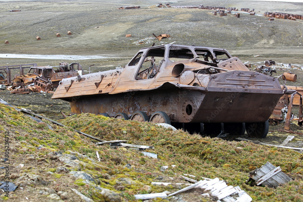 amphibious vehicle and piles of scrap metal waste in the Arctic Stock ...