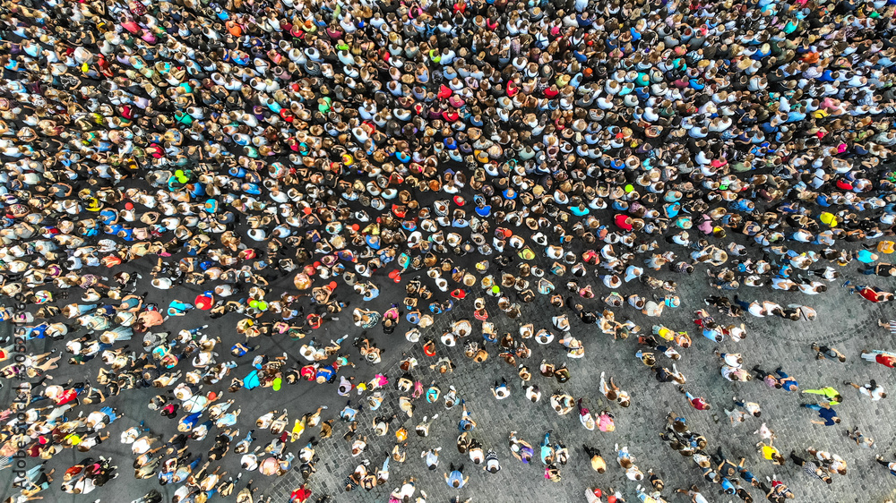 Aerial. Interested crowd of people in one place. Top view from drone ...