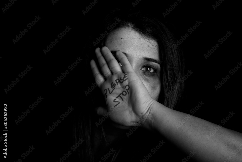 Stopping violence against women, Woman covering her face in fear of ...