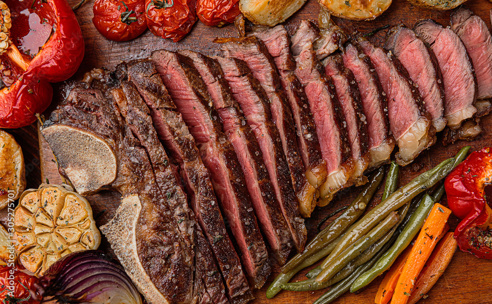 marbled beef steak on the bone cooked to a state of medium rare grill ...