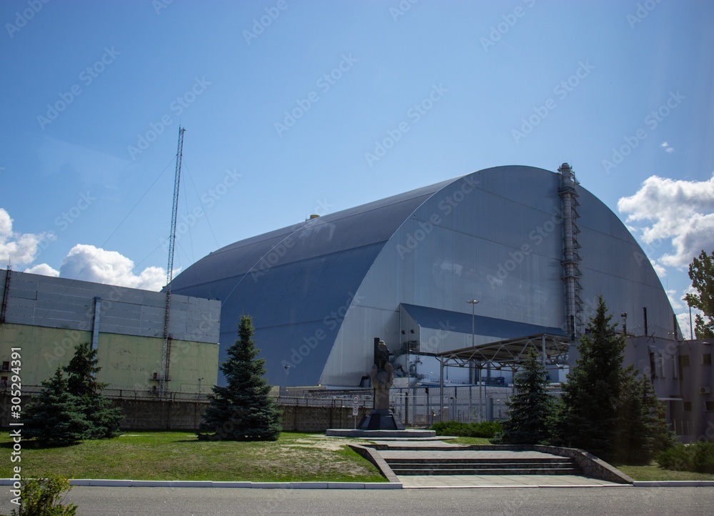 Chernobyl power plant reactor 4 sarcophagus and the monument in front ...