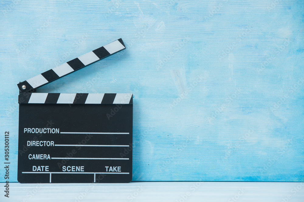 Movie clapper on blue background, cinema concept. Stock Photo | Adobe Stock