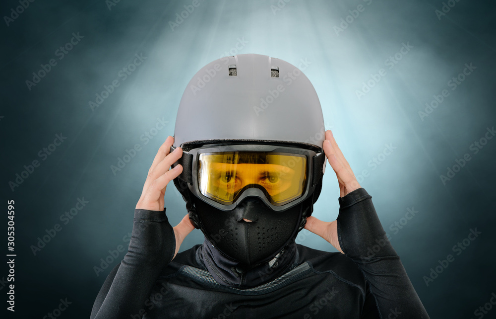 An athlete wearing a sweatshirt and helmet puts on Google. The concept ...