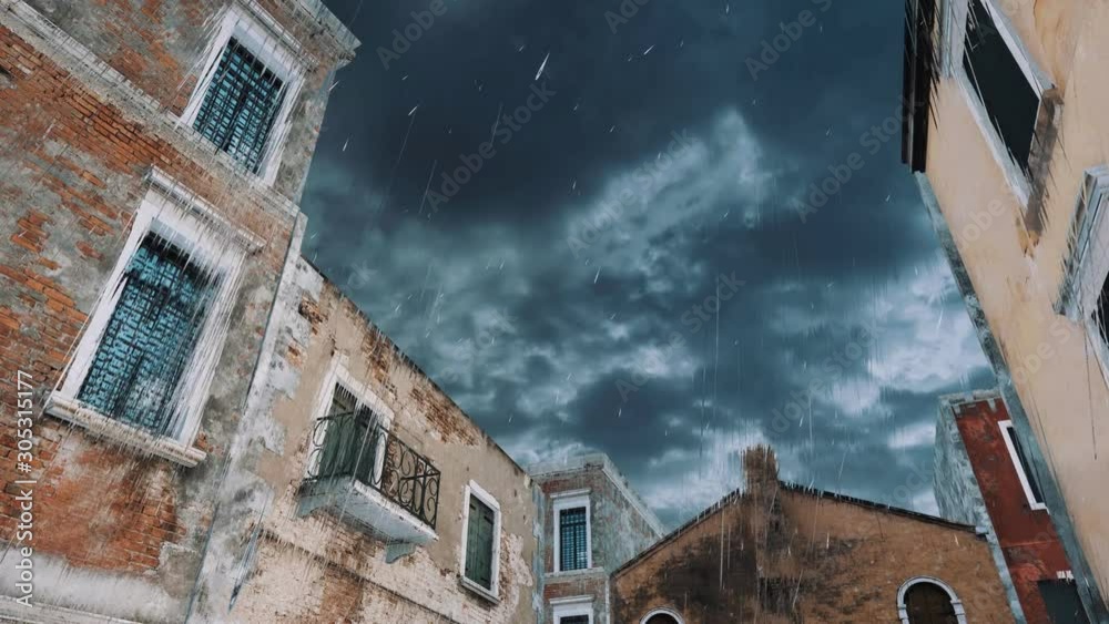 Looking up at ancient historic buildings against stormy sky background ...