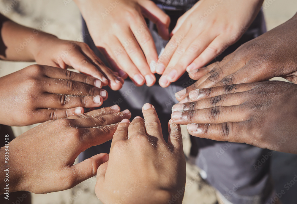 Multicultural childrens hands in a circle. Stock Photo | Adobe Stock
