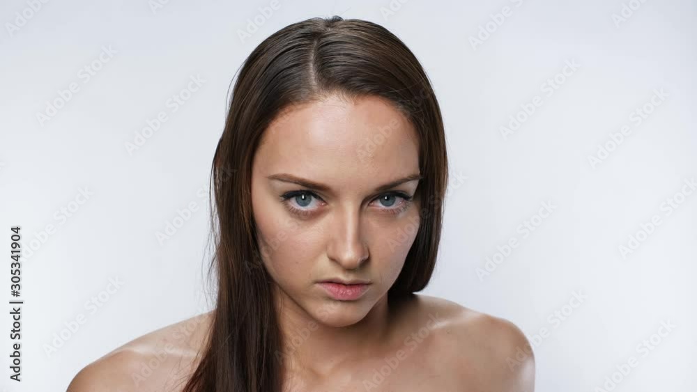 Serious look emotion person swirling on background. Eyes face turning ...