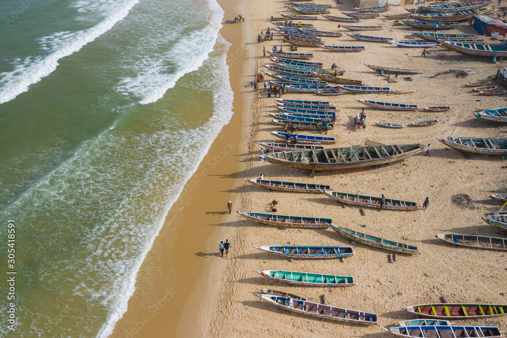 Aerial view of fishing village, pirogues fishing boats in Kayar ...