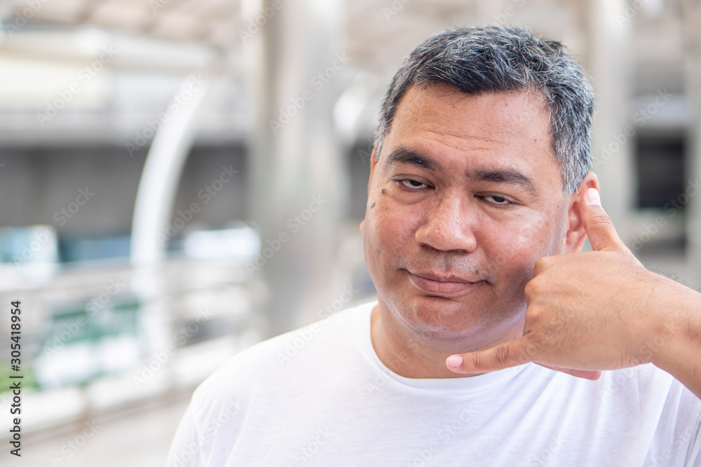 tired, disappointed old senior man with customer support or information ...