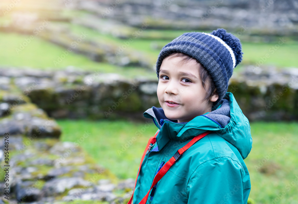 Portrait of School kid explore and learning about history with school ...