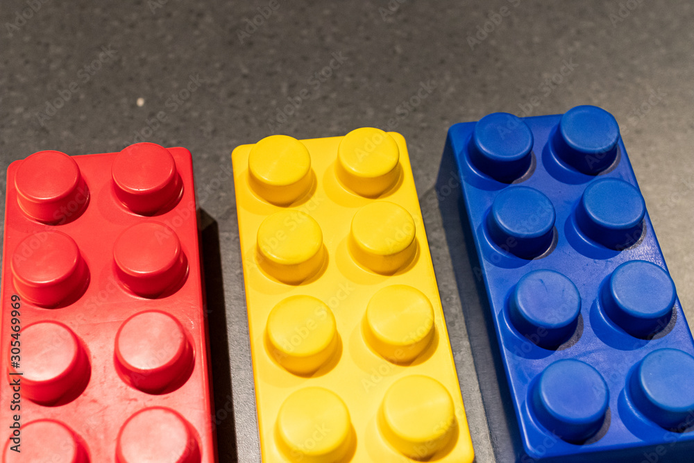 rectangular building blocks for children in yellow, blue and red colors ...