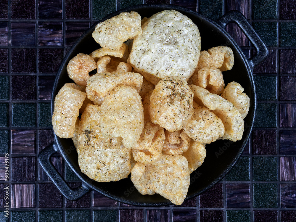 Pork rinds also known as chicharron or chicharrons, deep fried pork ...