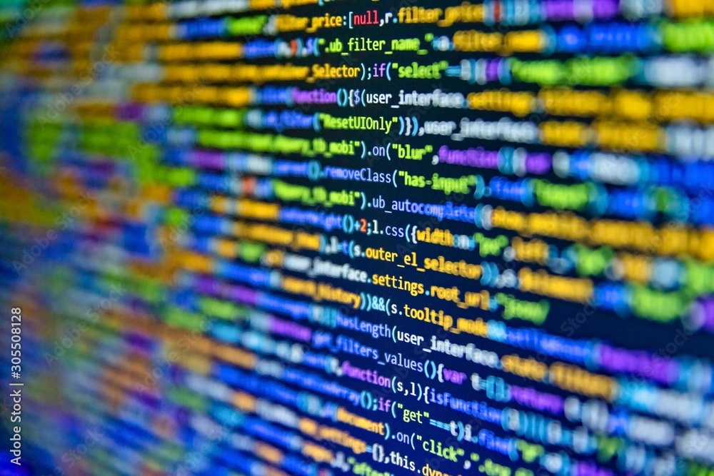 Code on dark background. Lots of digits on the computer screen. Shallow Depth of Field effect ...