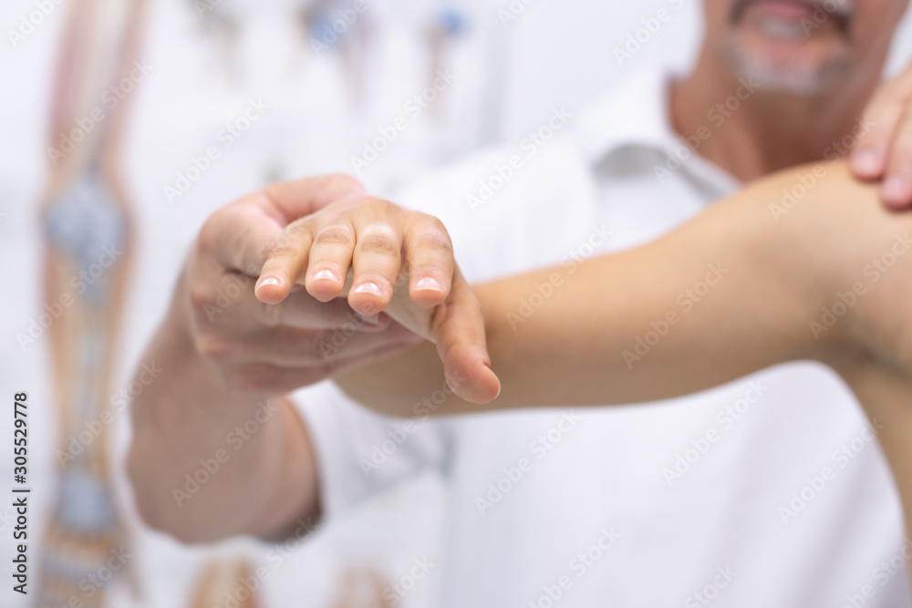 Doctor hand Physicist physical therapy treatment patient in the clinic ...