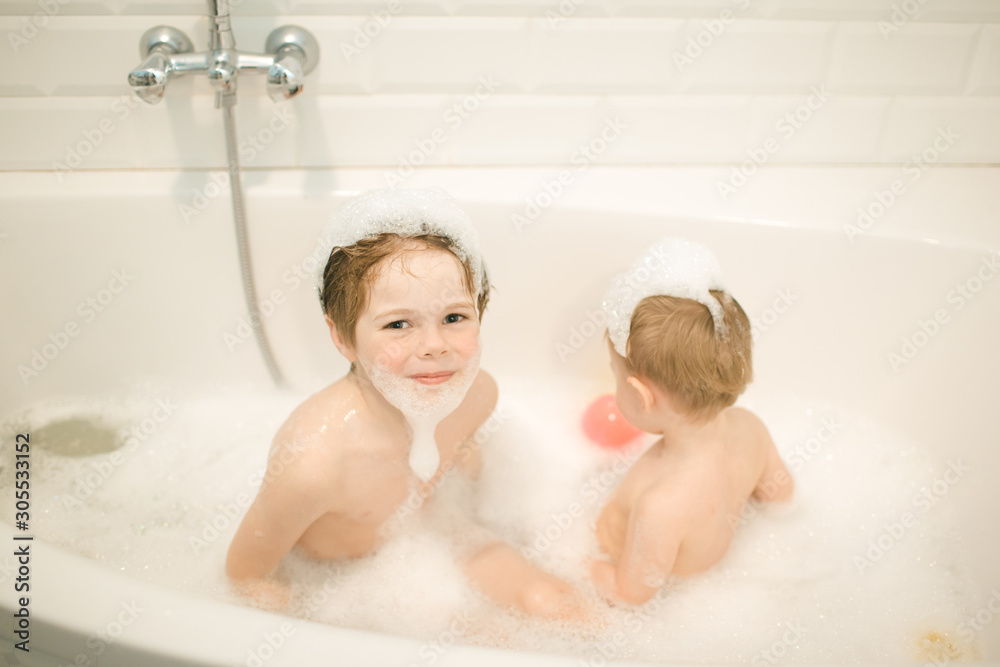 Brothers bathe in the bathroom Stock Photo | Adobe Stock