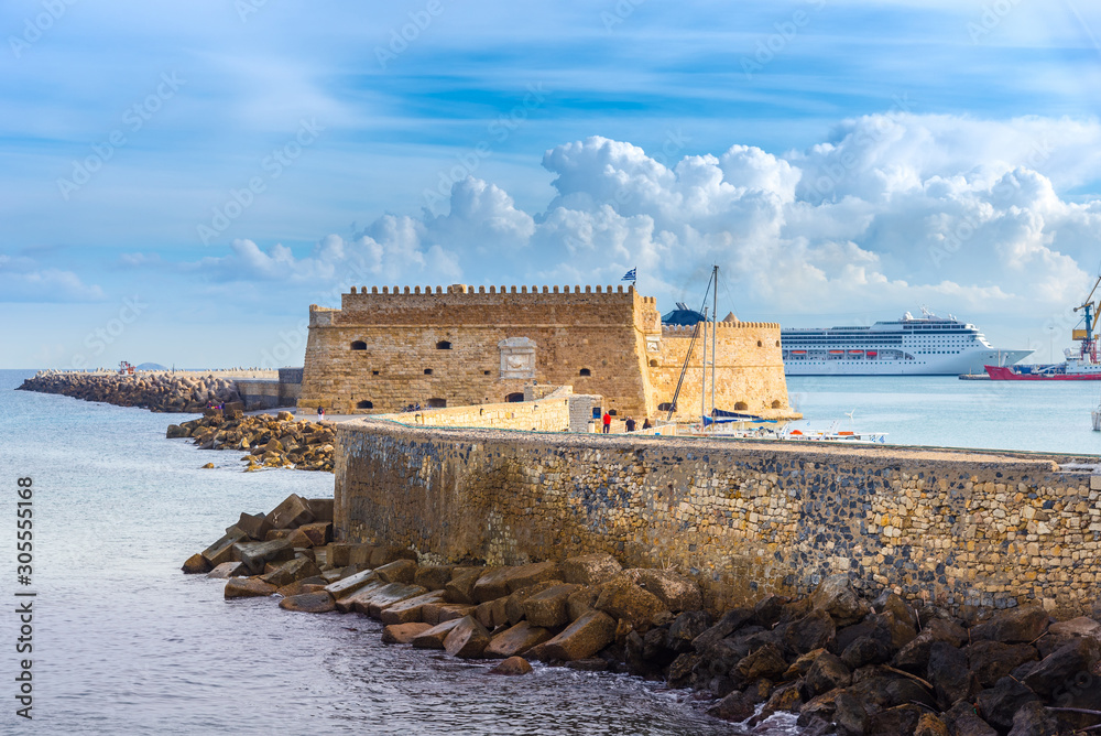 Heraklion harbour with old venetian fort Koule and shipyards, Crete ...