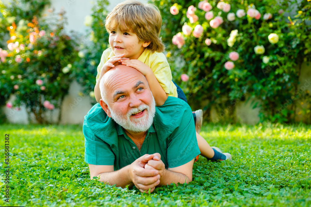 Happy grandfather and grandson relaxing together. Grandfather and ...