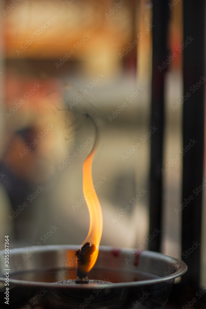 Single fire light lit and float on the oil lamp.Chinese shrine Fire Oil ...