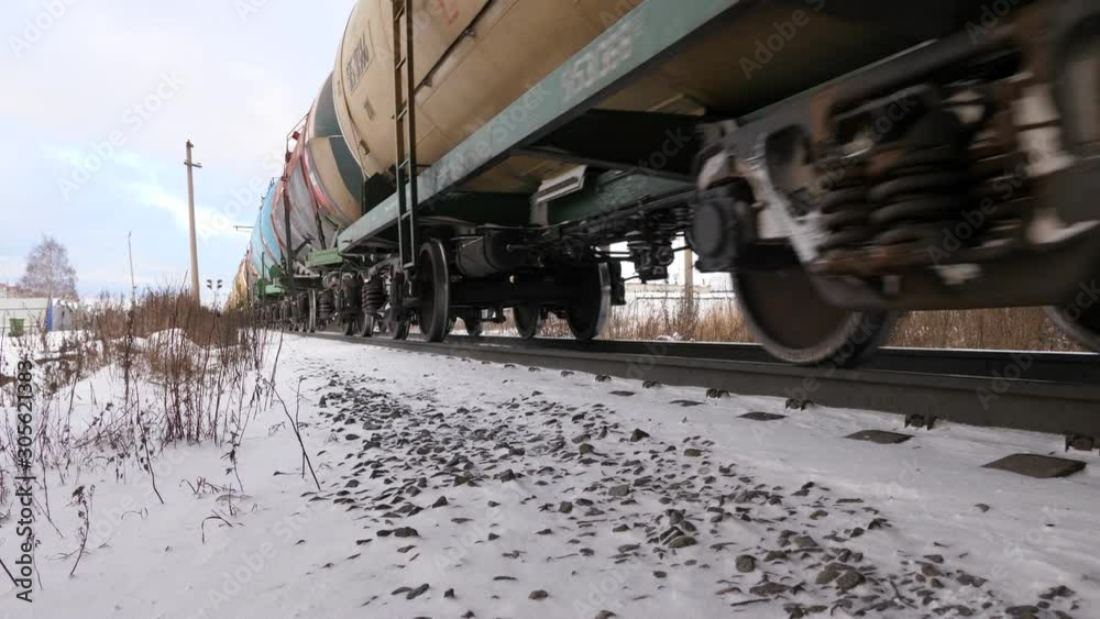Rail tank train move at winter city outdoors, wide angle shot, low ...