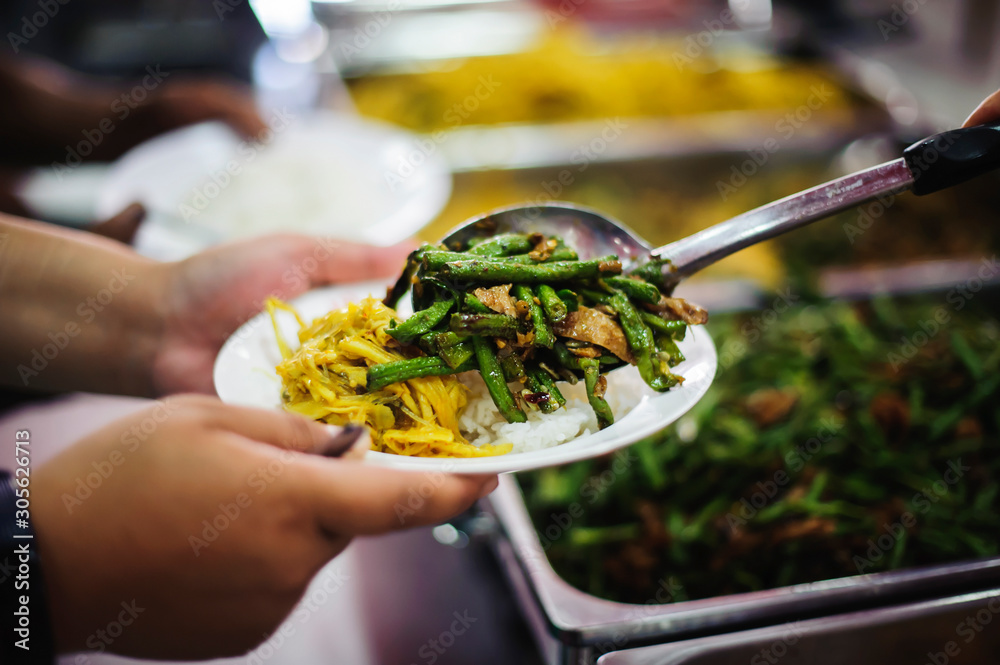 The beggars receive food from the help of the generous in society: the ...