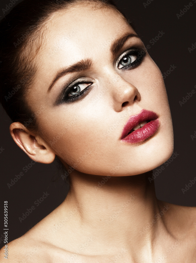 Beautiful face of a glamour woman with smoky eyes make up. Close-up ...
