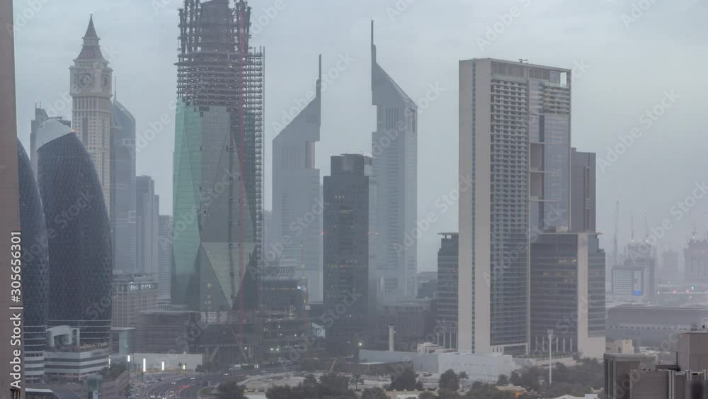 Dubai downtown skyline night to day aerial timelapse with traffic on ...