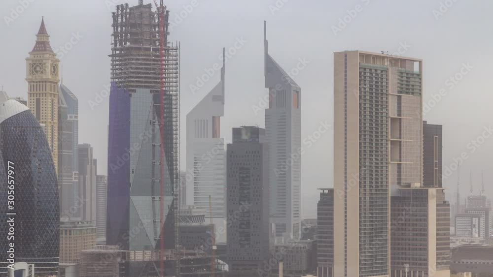 Dubai downtown skyline at cloudy morning timelapse with traffic on ...