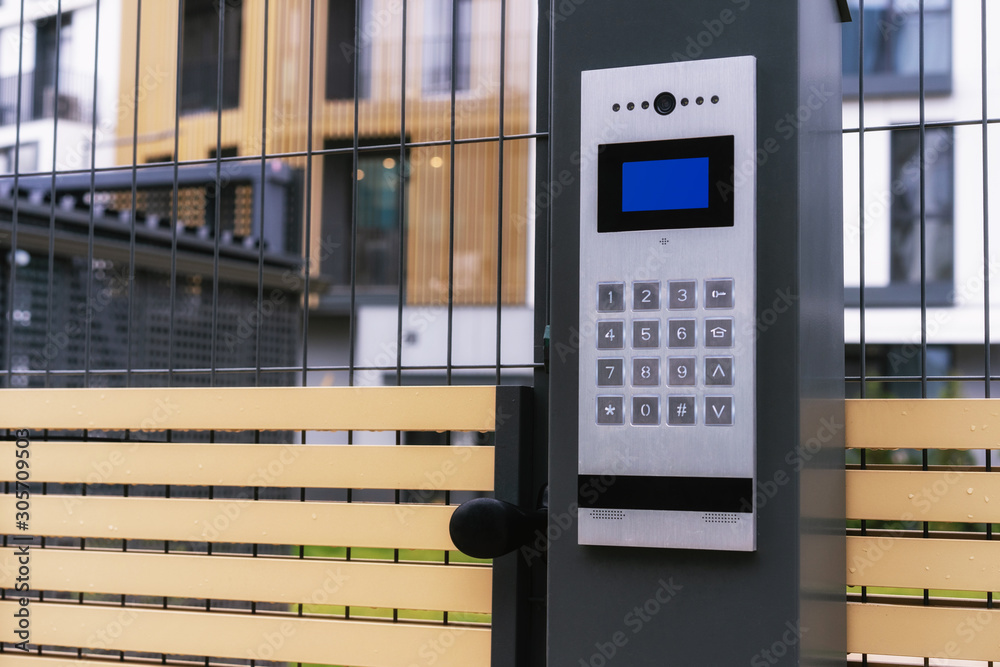 safety in modern residential buildings. fenced yard, closed gate with ...
