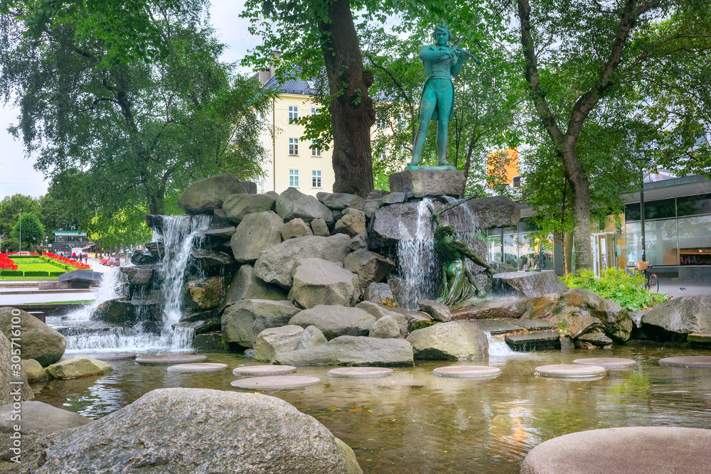 Fountain with statue of violinist and composer Ole Bull in Bergen city ...