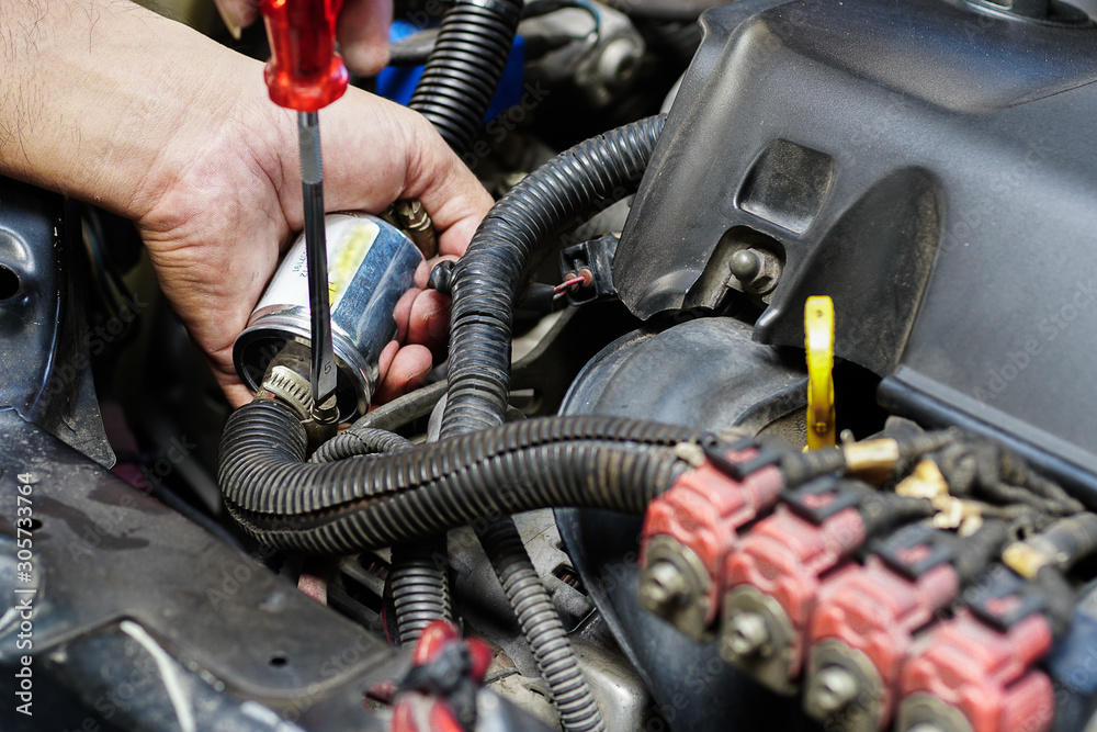 LPG filter are installed in to a car for the 2 fuel system. Stock Photo ...