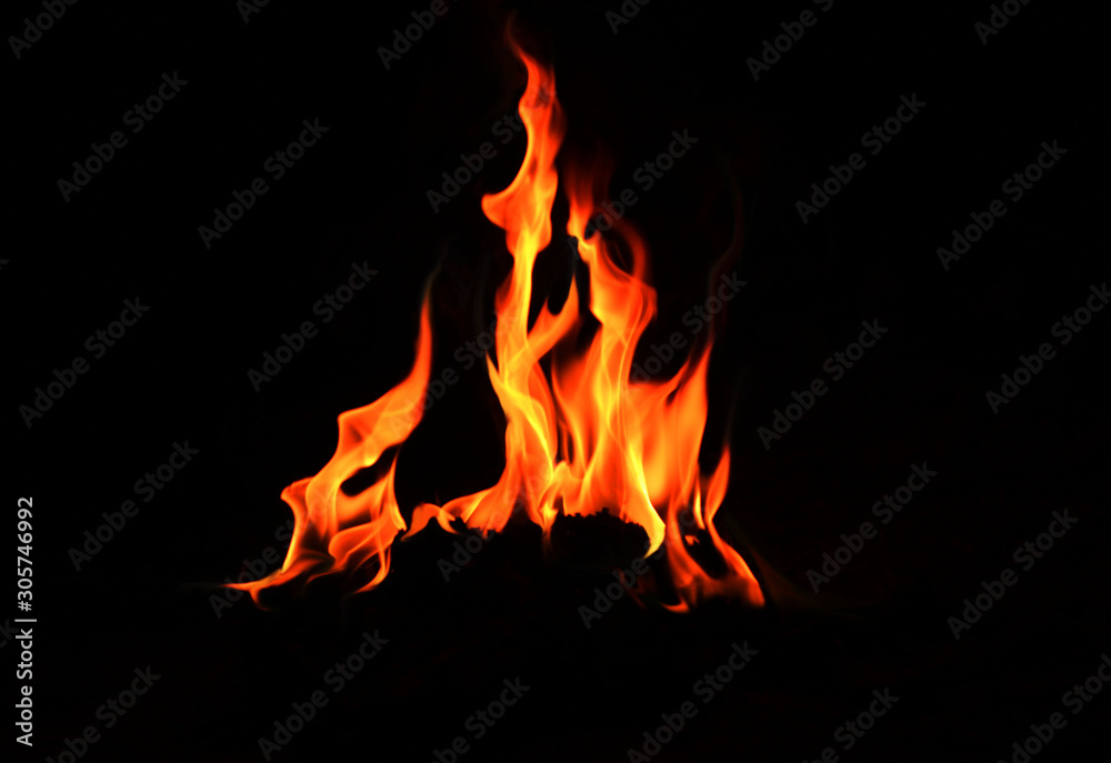 Various fire energy patterns that are burning on a black background ...