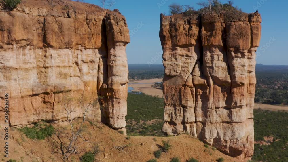 Spectacular aerial view flying through a gap of the beautiful red ...