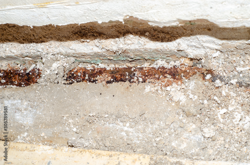 dig in concrete slab broken rusty water pipe, moisture spotting roach ...