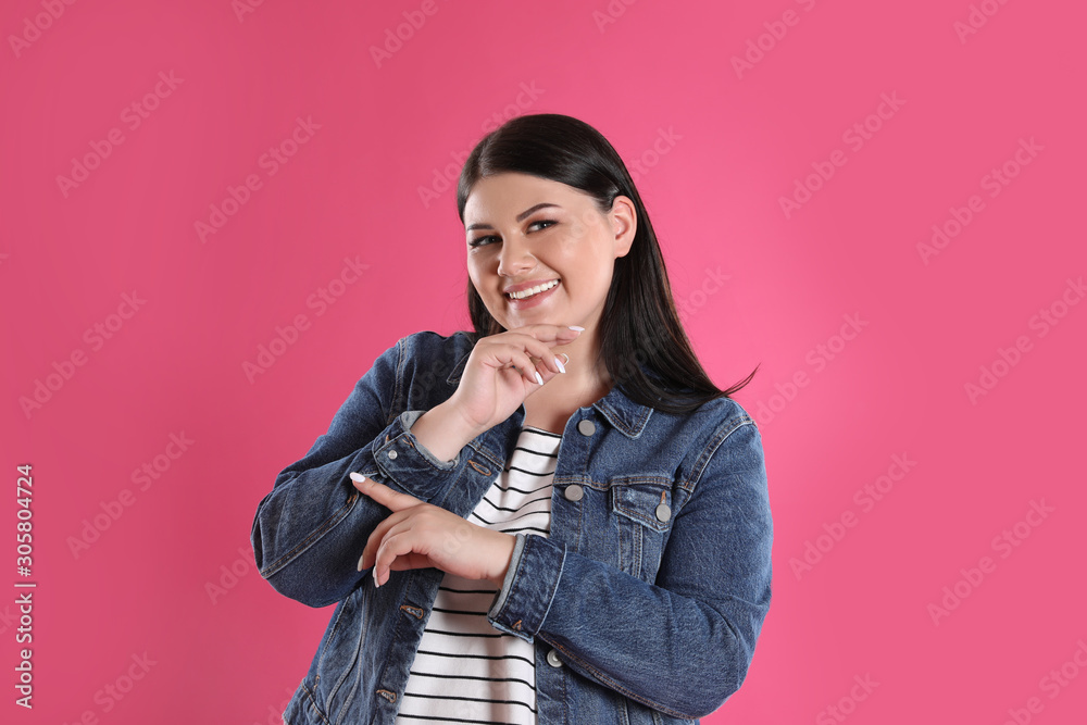 Beautiful overweight woman posing on pink background. Plus size model ...