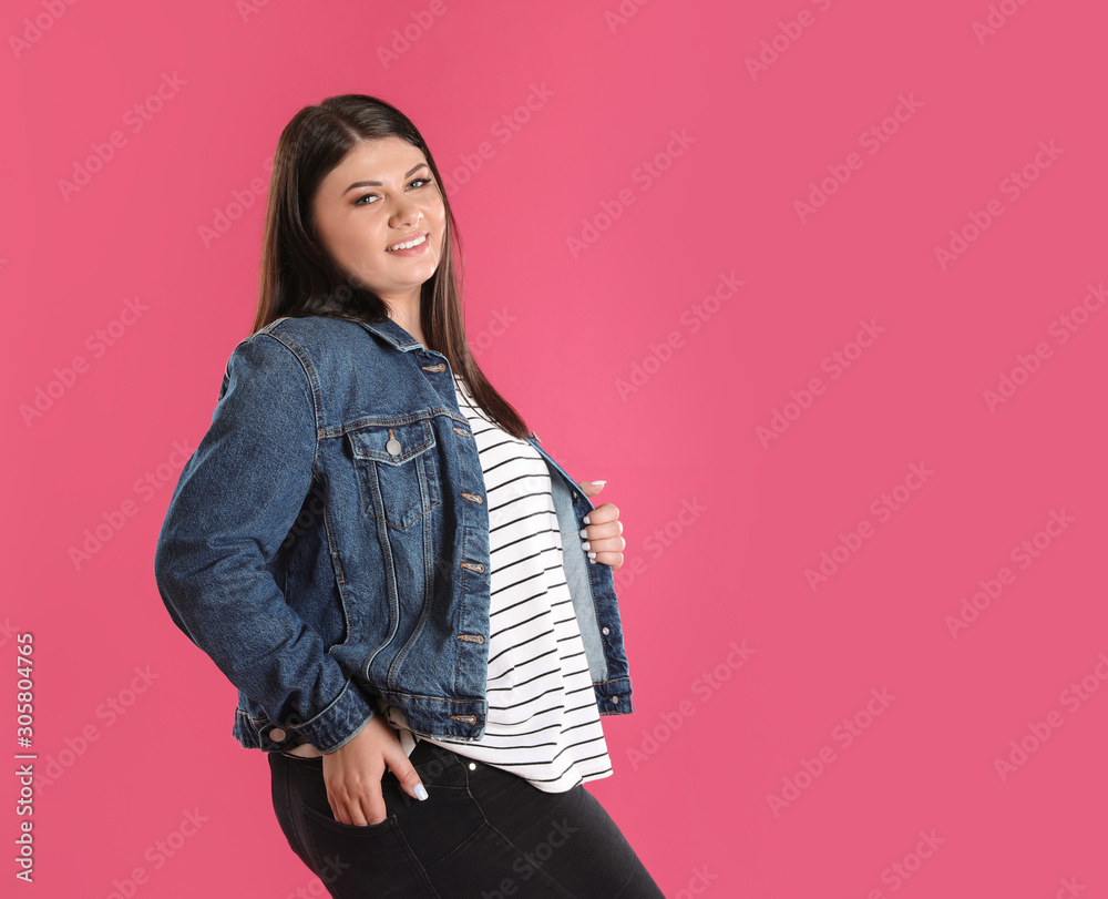 Beautiful overweight woman posing on pink background. Plus size model ...