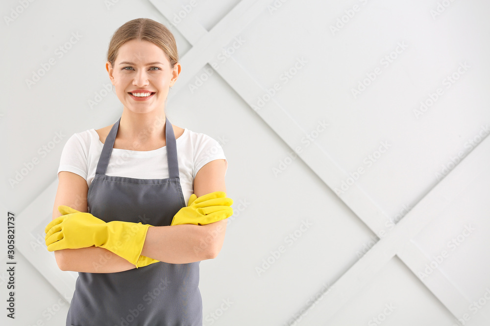 Female janitor on grey background Stock Photo | Adobe Stock