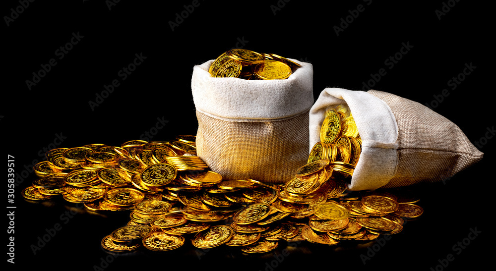 Stacking gold coin in treasure sack lot of at black background Stock ...